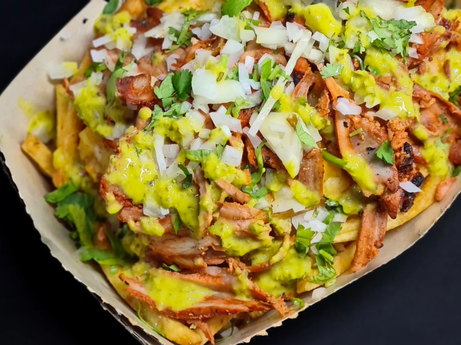 Next Level Fries · Papas cargadas, nachos y toppings al gusto